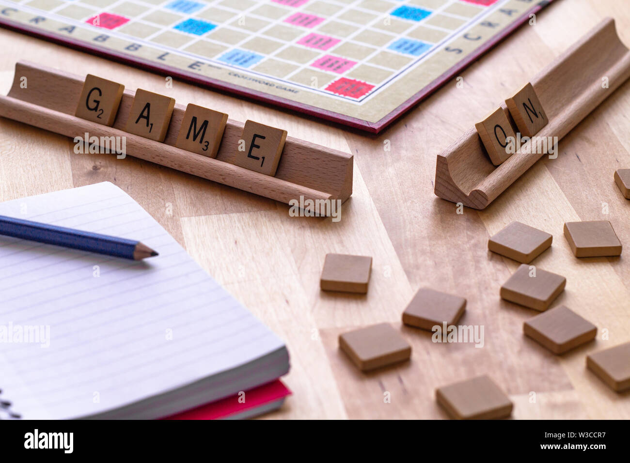 Scrabble board game with the scrabble tile spell "Game On Stock Photo ...