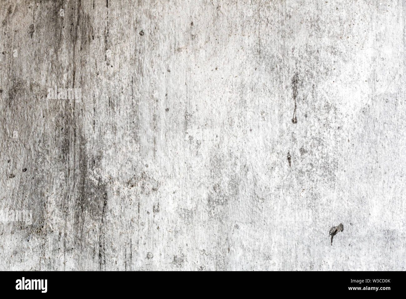 Dirty burnt gray wall detail with dominantly black and white colors as ...