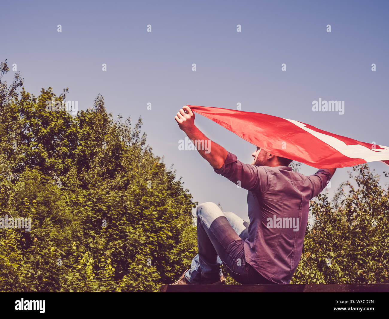 Young man waving canadian flag hi-res stock photography and images - Alamy