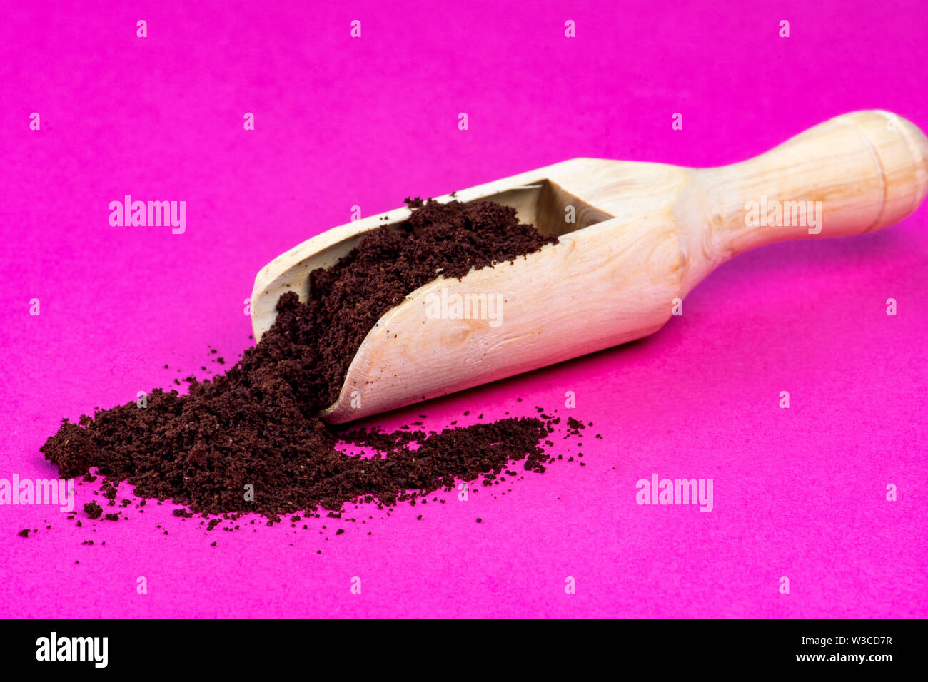 wooden spoon Coffee powder on pink background pure caffeine Stock Photo ...