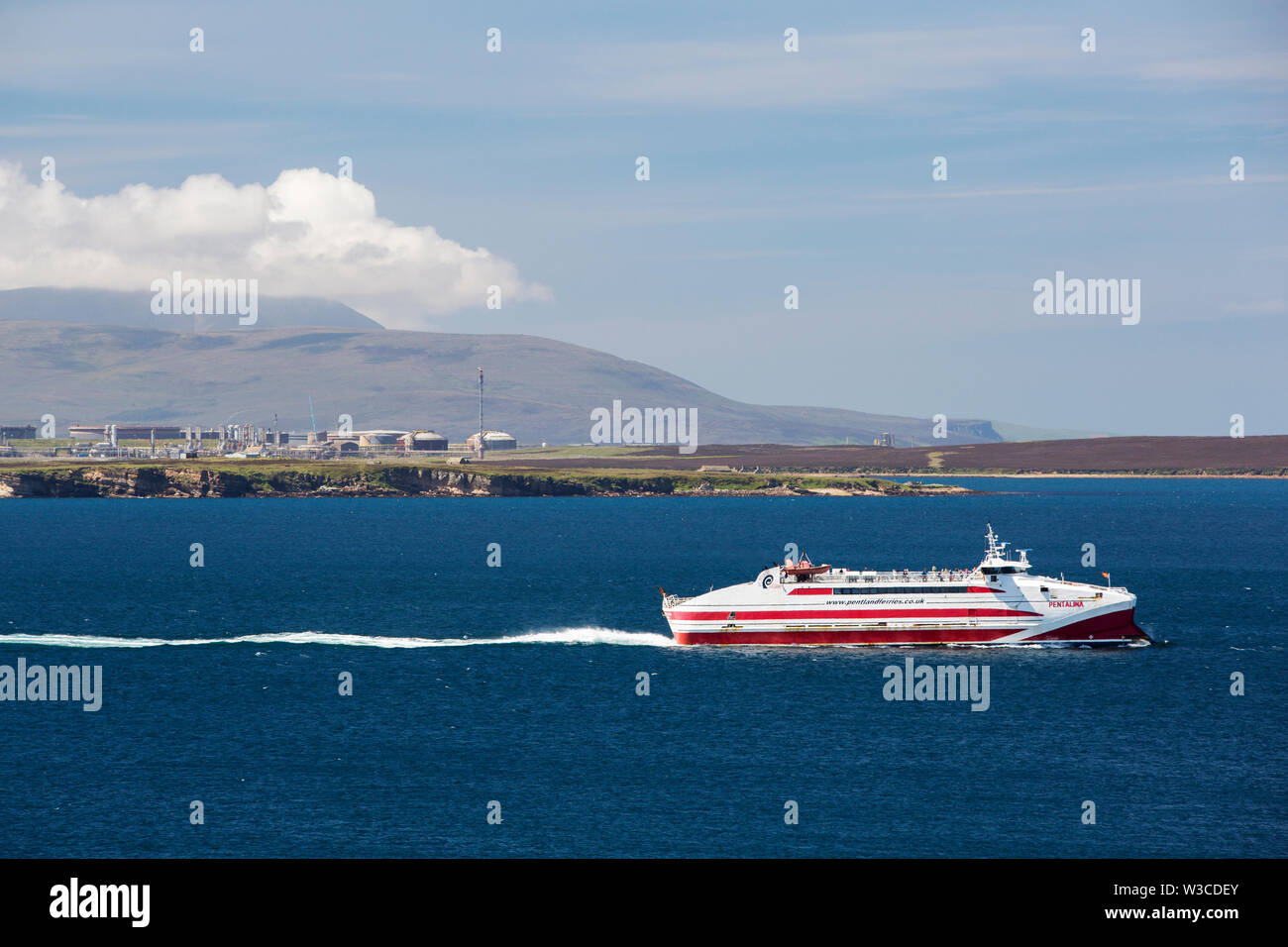 The Orkney ferry passing the Flotta oil terminal, Orkneys, Scotland, UK ...