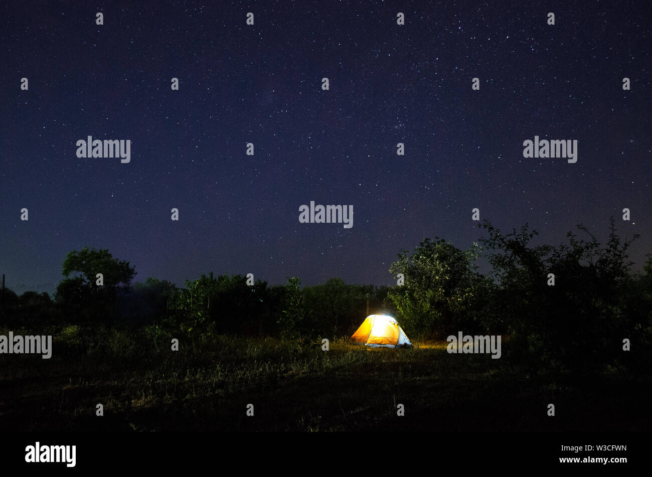 Camping tent under beautiful night sky full of stars. Starry night sky ...