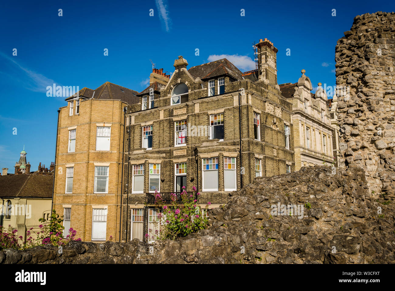 Old residential houses just beyond the stone wall of the Rochester ...