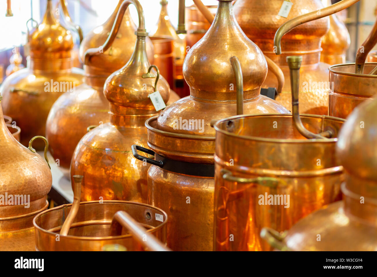 Copper ware, serpentine and jugs on the shop window in the store Stock ...