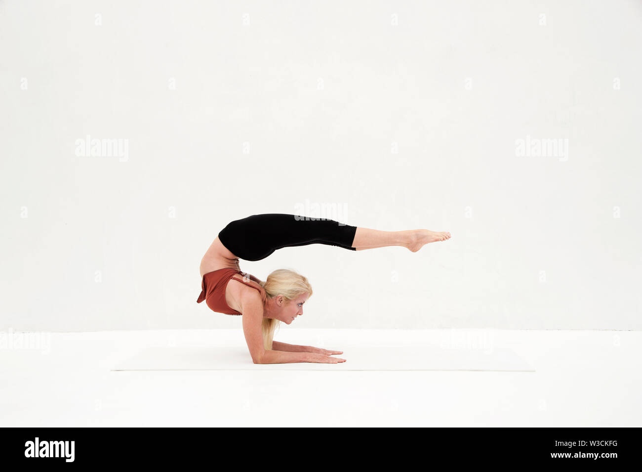 Advanced Yoga Practitioner Woman in Extreme Yoga Pose Stock Photo - Alamy