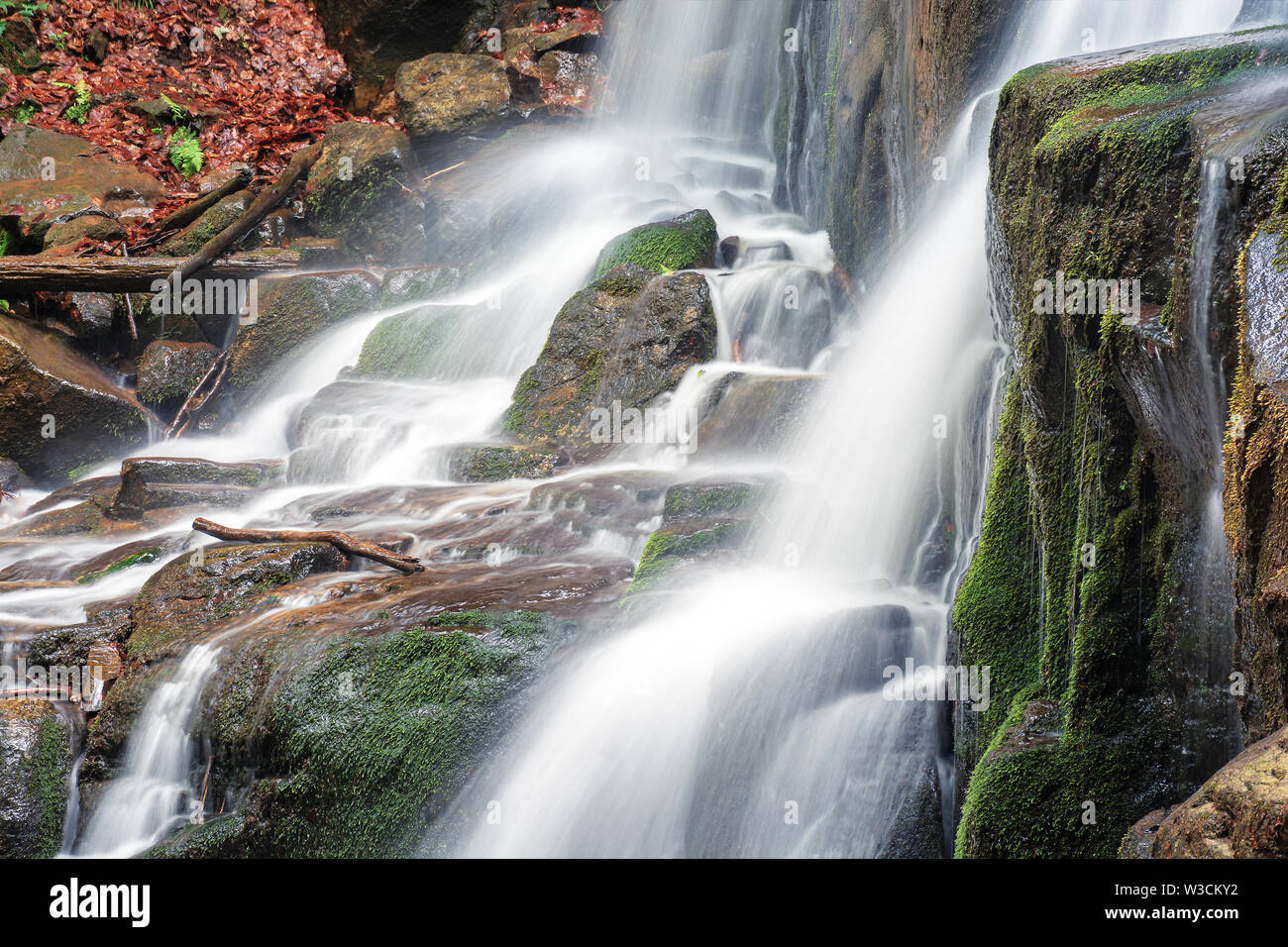 close up details of waterfall stream. rapid flow with long exposure ...