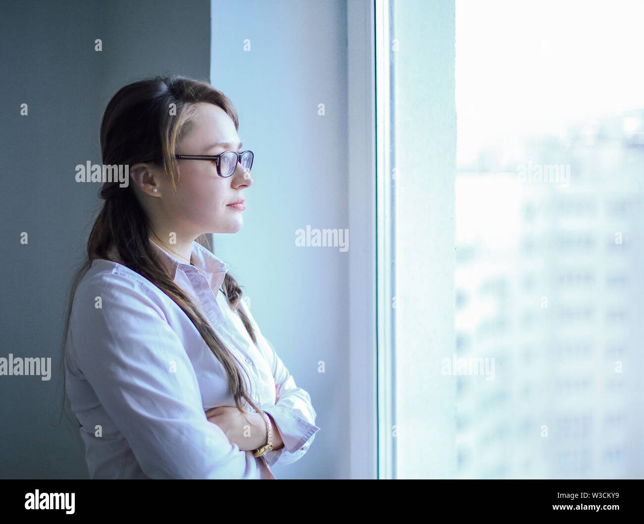 Executive business woman looking out the office window.photo with copy ...
