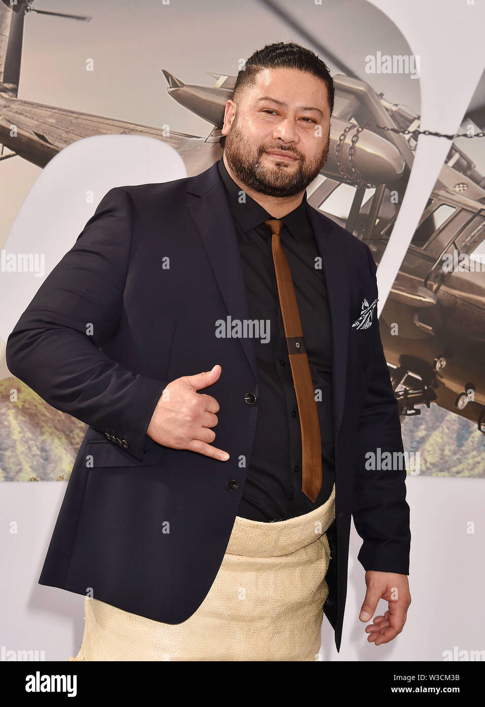 HOLLYWOOD, CA - JULY 13: John Tui attends the Premiere Of Universal ...
