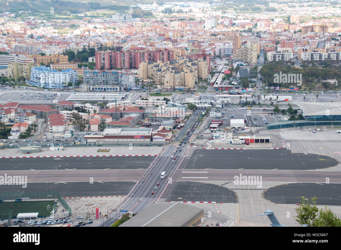 A public highway crossing an active airport's runway at the Gibraltar ...