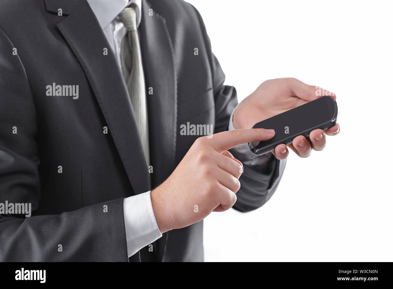 close up. businessman tapping the screen of the smartphone.photo with ...