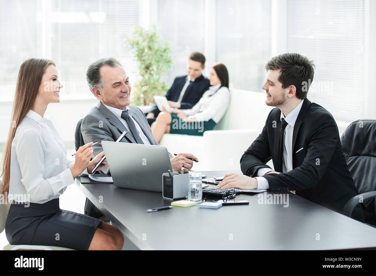 client talking with the staff at the Desk in the office.photo with copy ...
