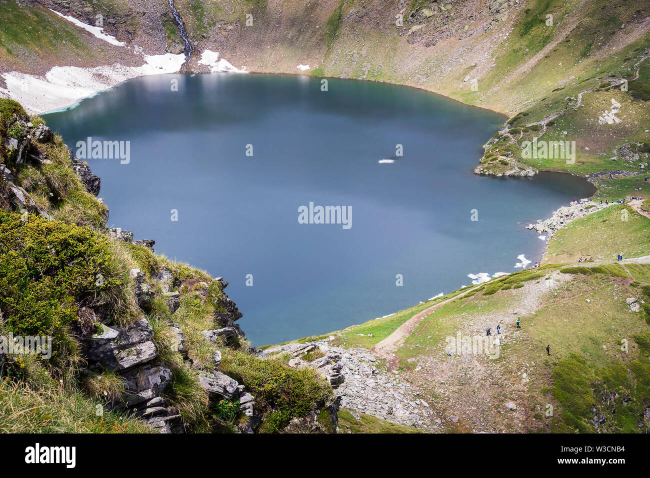 Framed view of the Eye lake, one of seven Rila lakes, lots of mountain ...