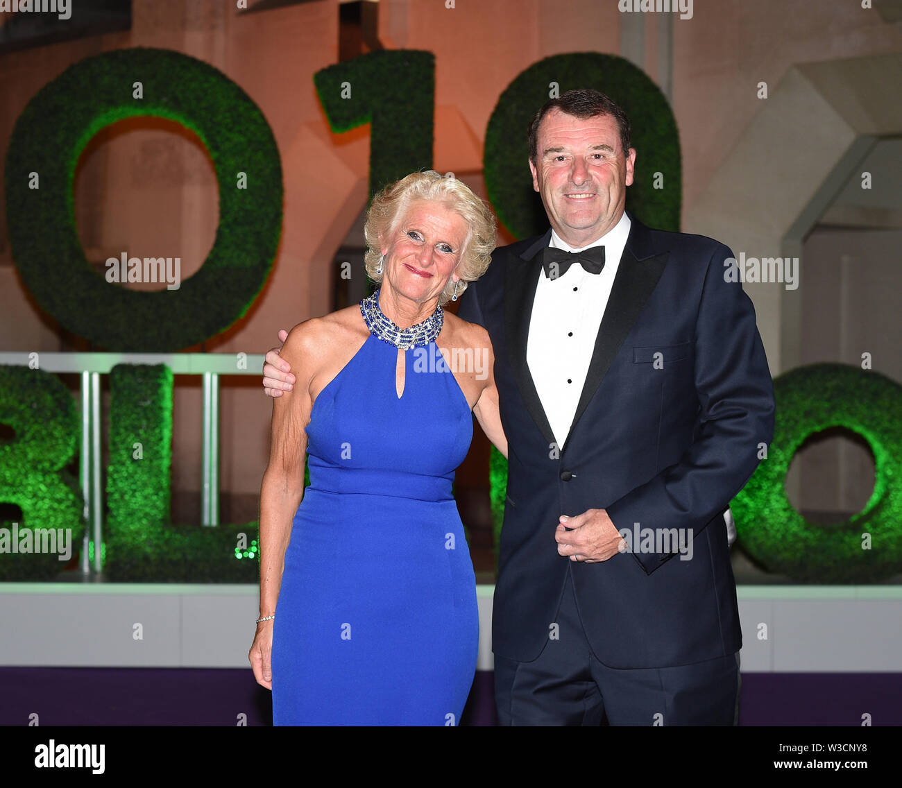Philip Brook chairman of the AELTC and his wife Gill Brook arrive at ...
