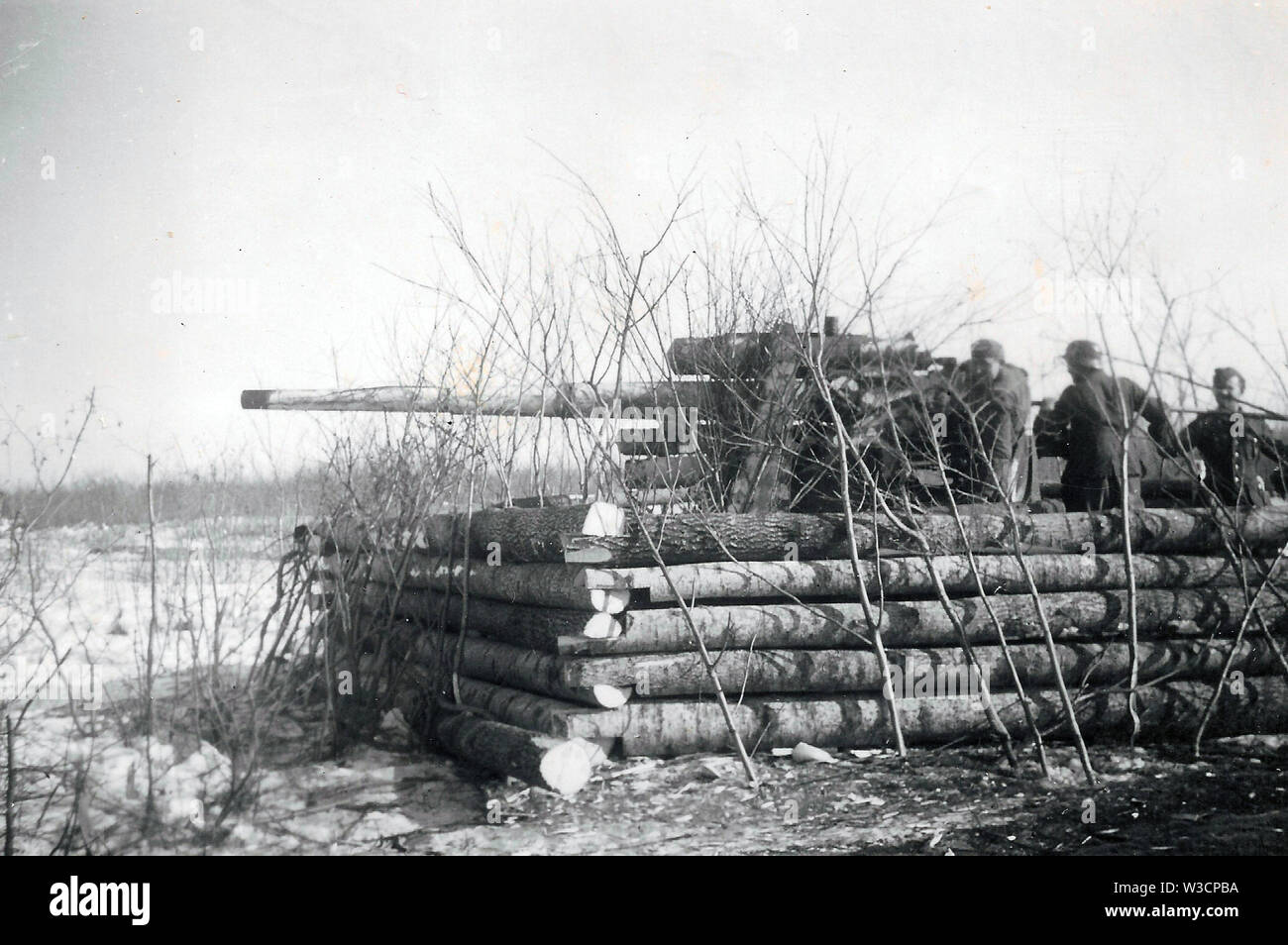 German Soldiers fire an 88mm Gun from an open timber Bunker on the ...