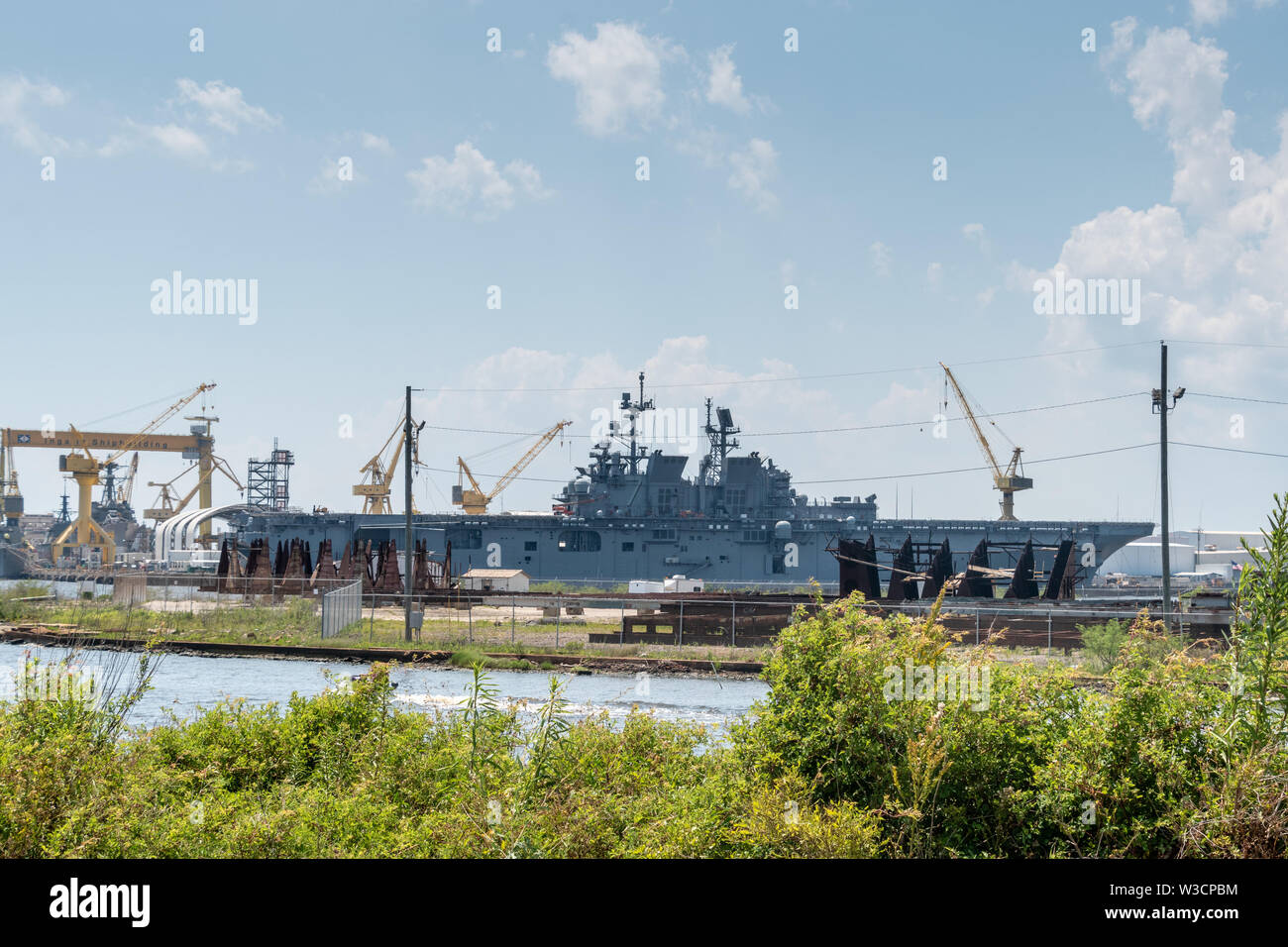 The ship yard of Ingalls Shipbuilding with several military Navy war ...