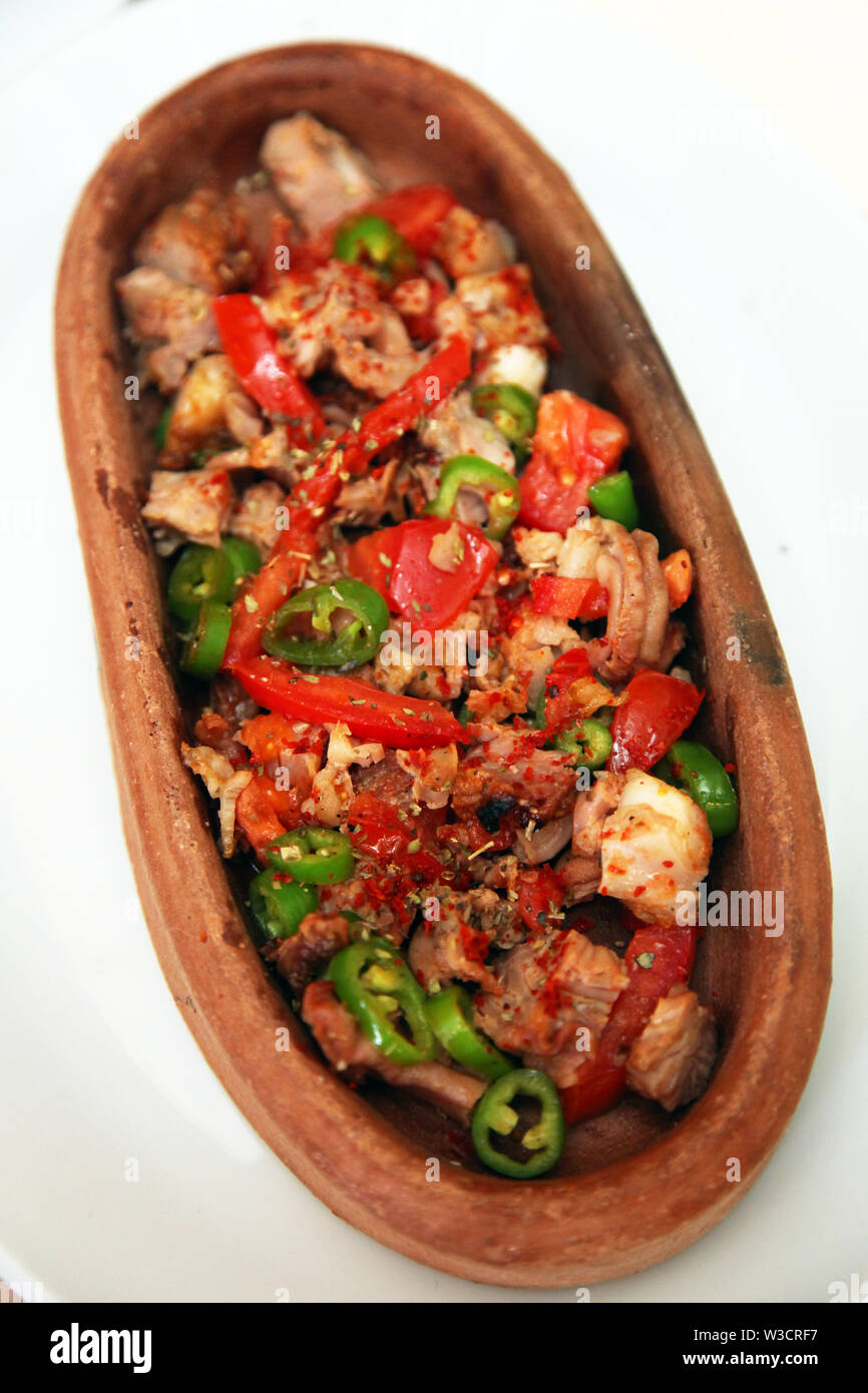 Delicious chicken with vegetables in the guvec (Turkish cuisine) on the ...