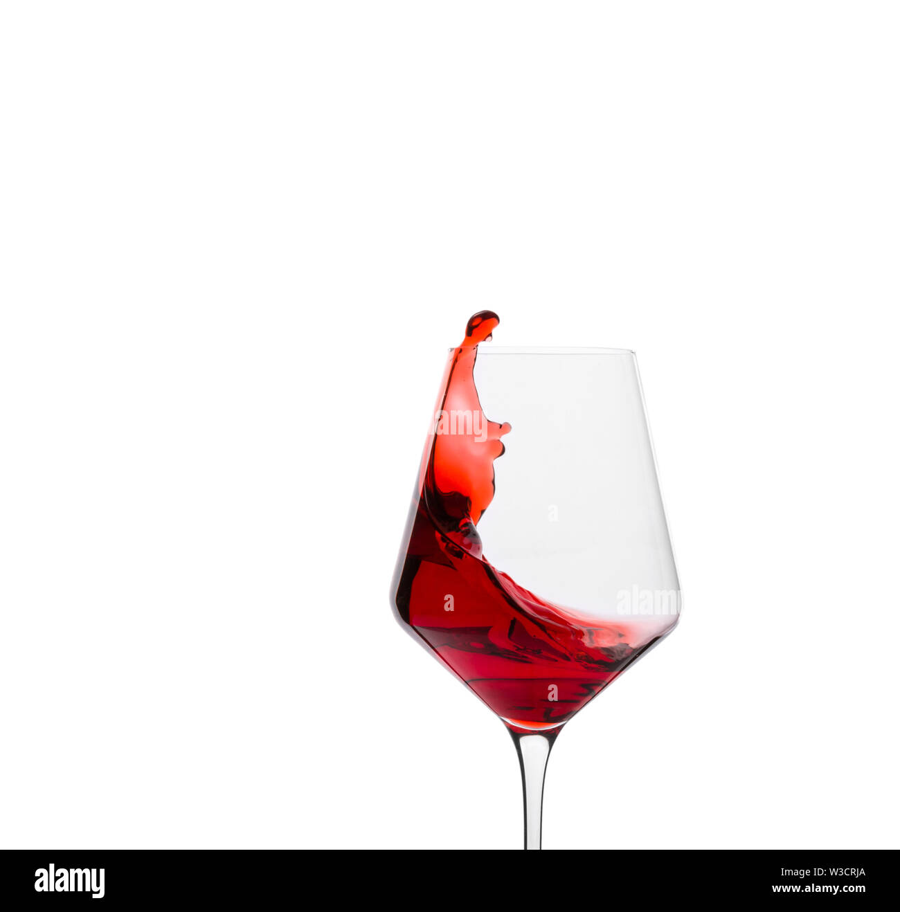 Glass of red wine with splashes on white background Stock Photo - Alamy