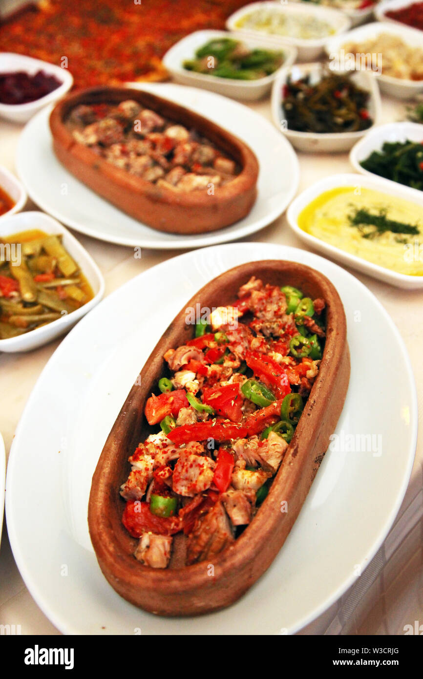 Delicious chicken with appetizer foods in the guvec (Turkish cuisine ...