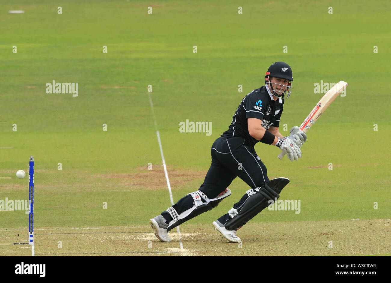 London, UK. 14th July, 2019. Henry Nicholls of New Zealand plays a shot ...