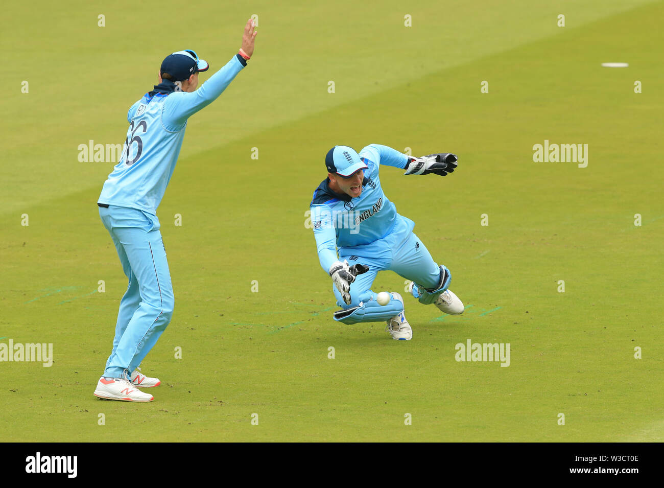 London, UK. 14th July, 2019. Joe Root and Jos Buttler of England ...