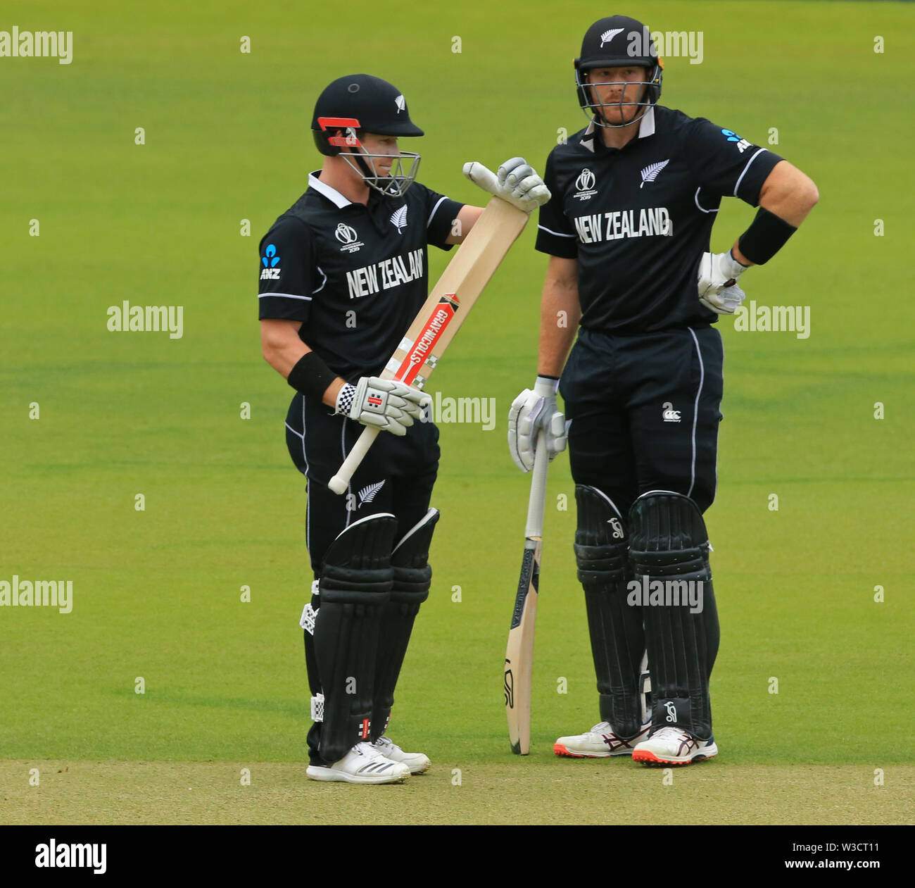 London, UK. 14th July, 2019. Henry Nicholls of New Zealand signals for ...