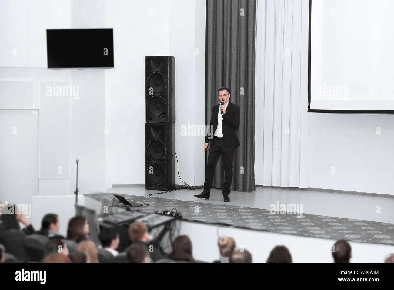 businessman man standing on stage during a press conference. business ...