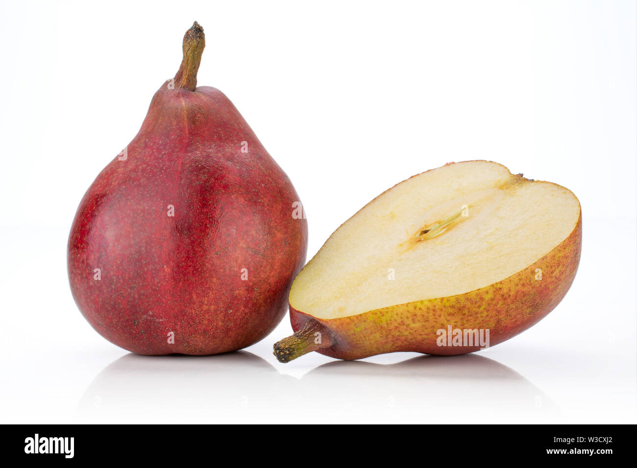 Group of one whole one half of fresh dark red pear anjou cross section ...