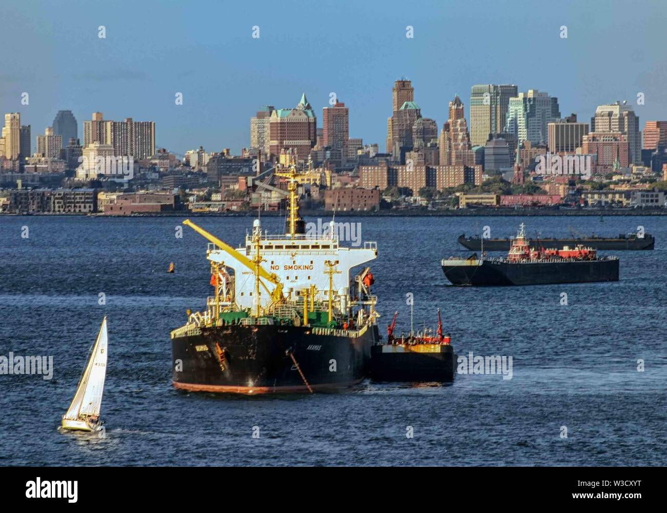 New York, New York, USA. 3rd Sep, 2005. A sailboat passes the oil ...