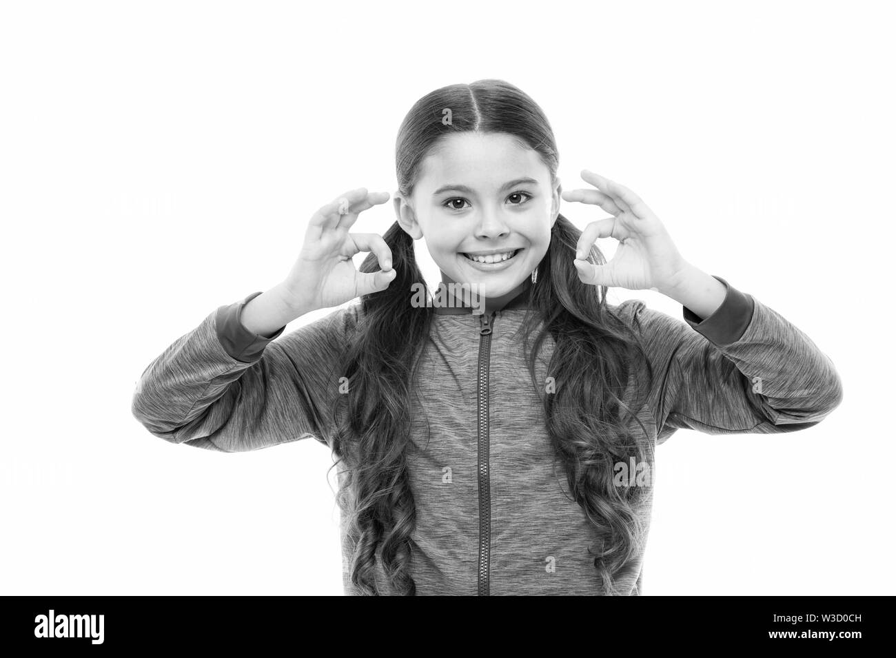 Things gonna be alright. Girl child happy face while show ok gesture ...