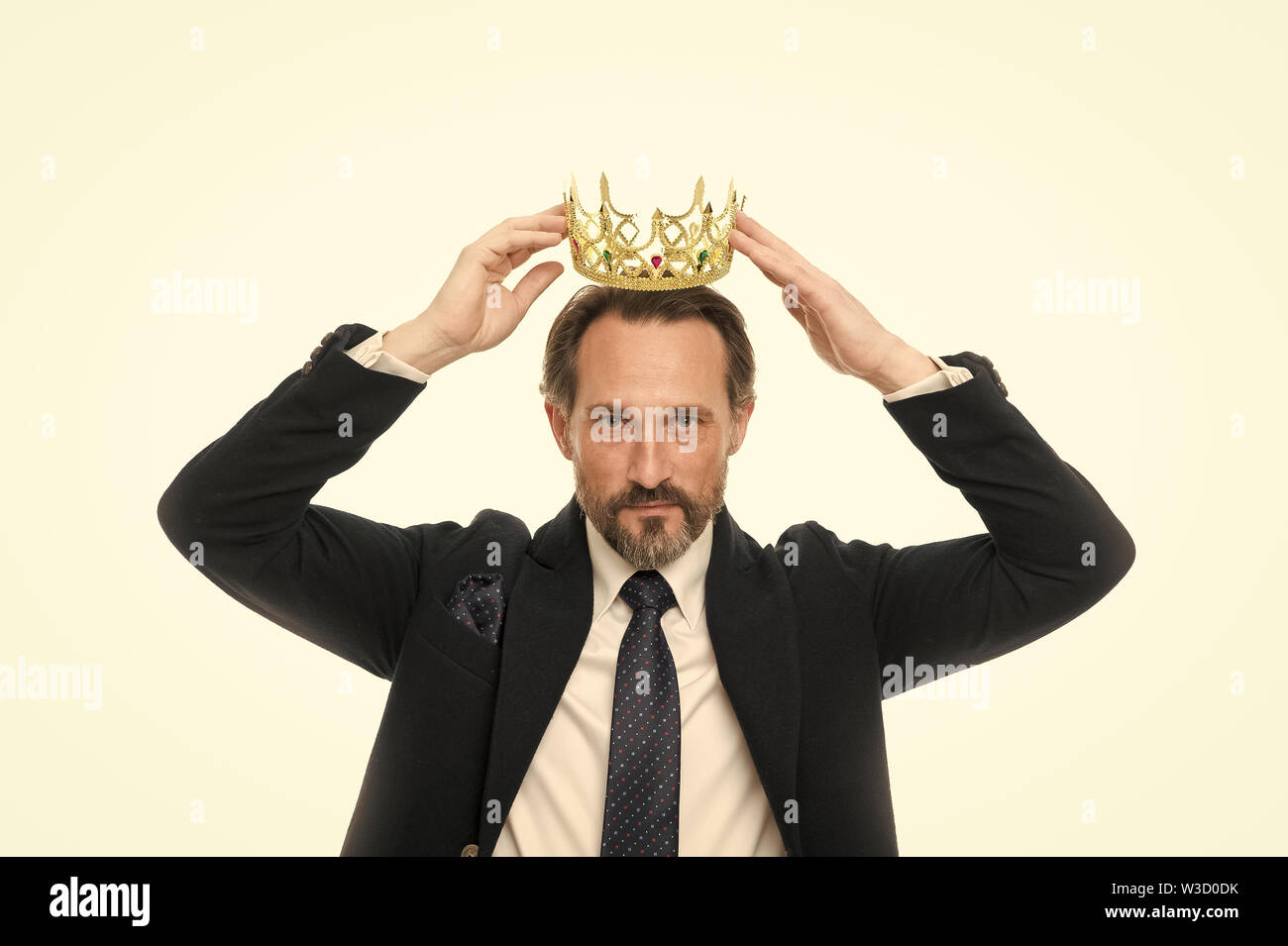 He is noble every inch of him. Mature businessman trying on crown. Fit ...