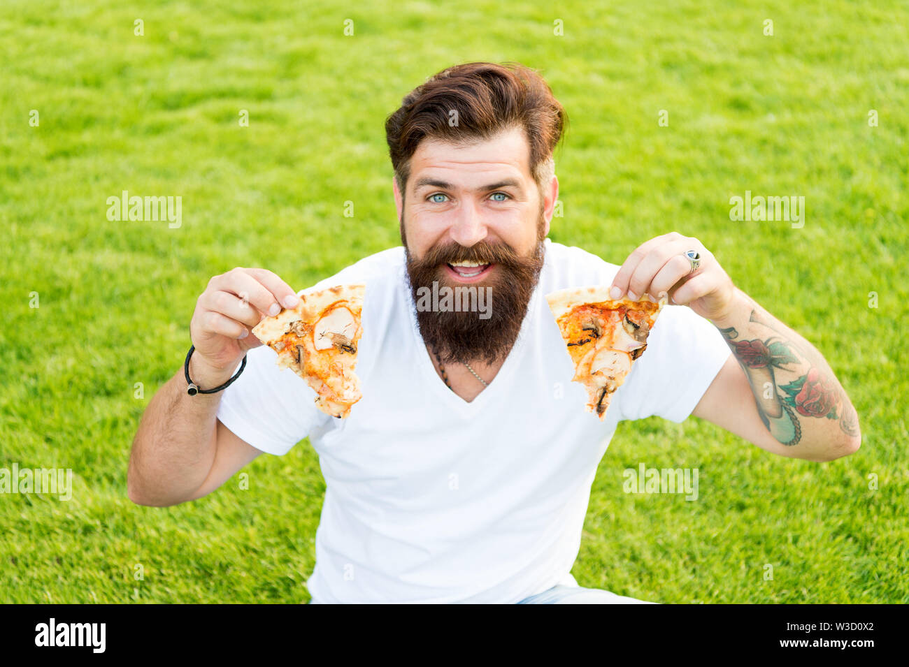 my favorite pizza. summer picnic on green grass. pizza weekend. fast ...