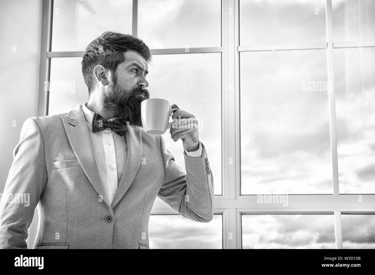 good morning coffee. serious bearded man drink coffee. businessman in ...