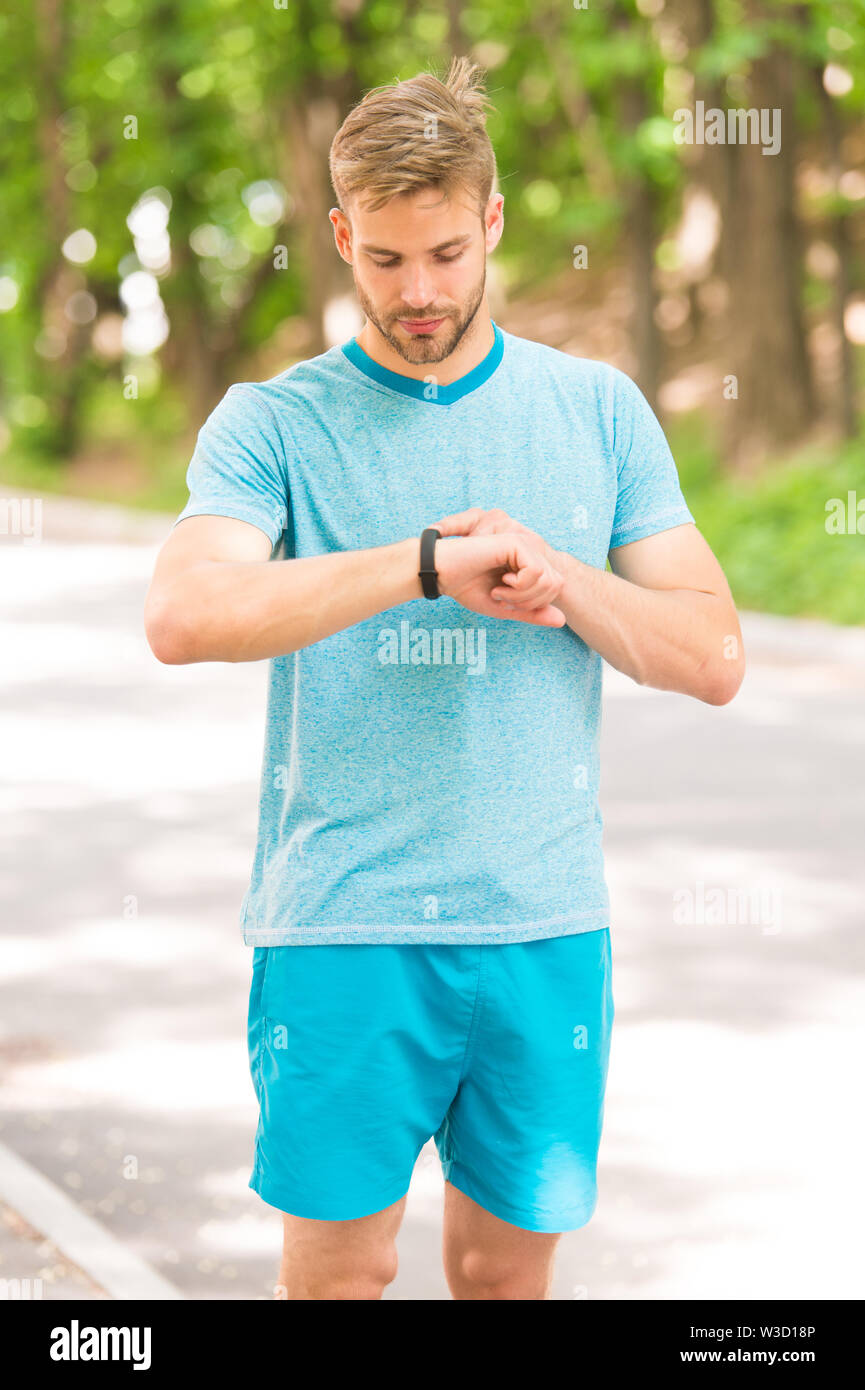 Combining technology with style. Fit man tracking his performance with ...