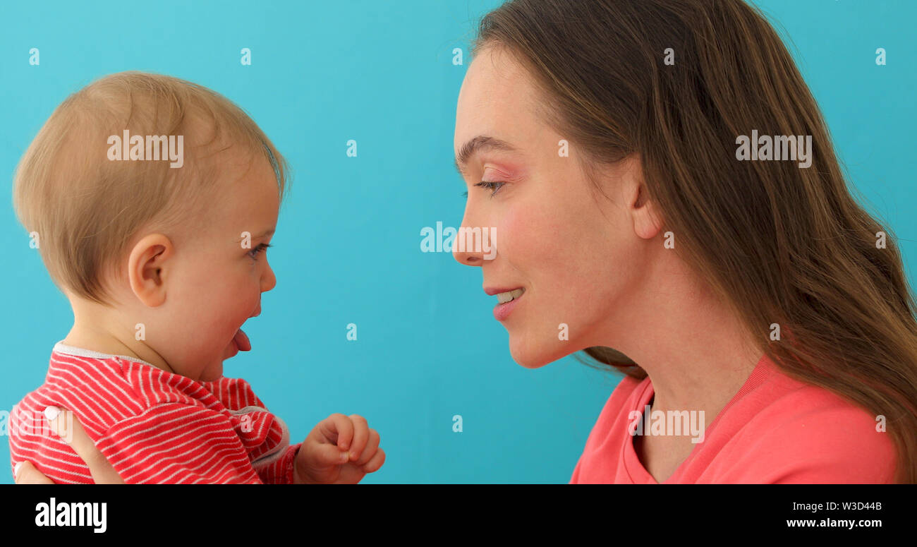 Caring mother playing with happy little baby Stock Photo - Alamy