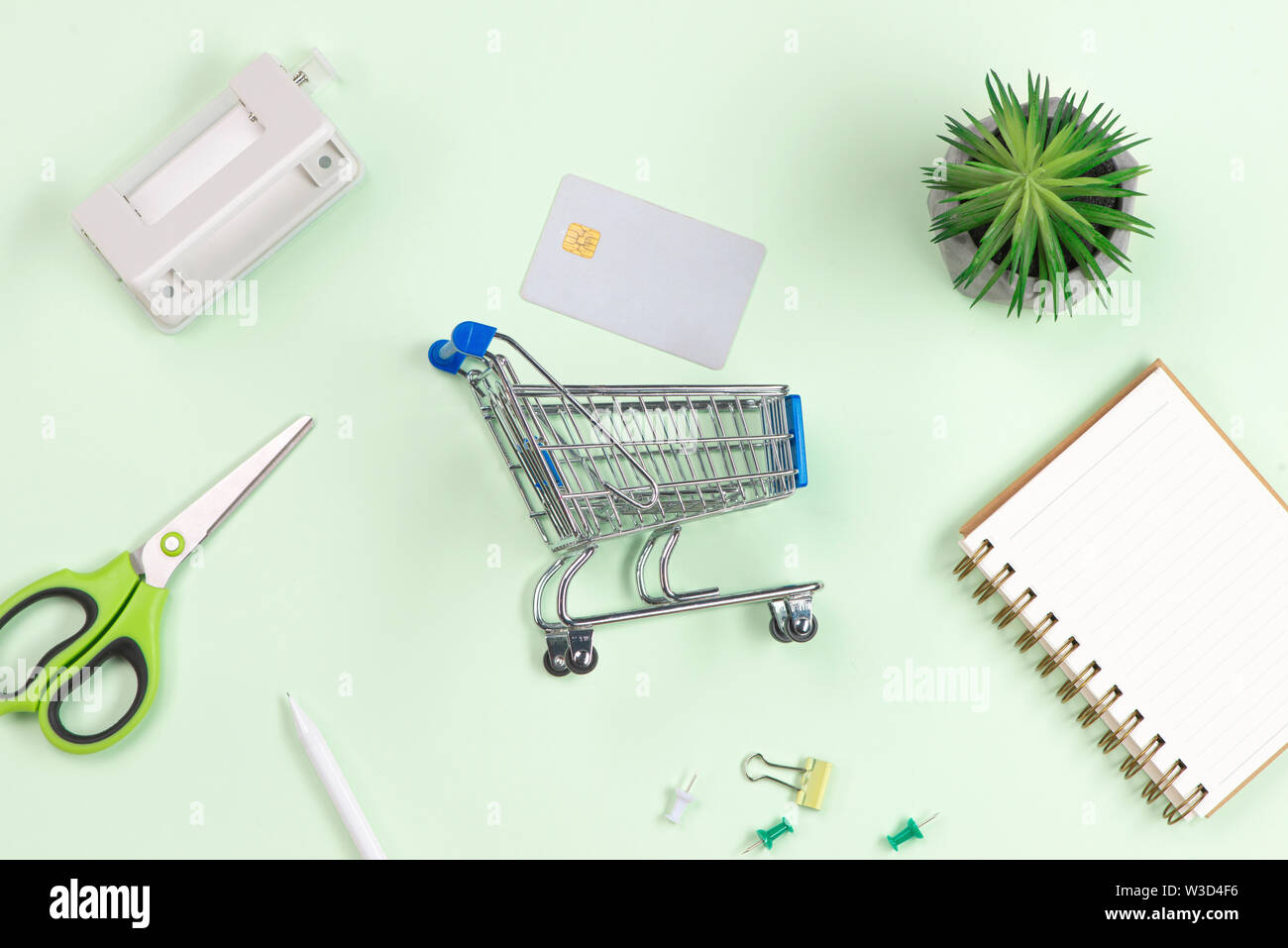 Shopping cart with credit cards on old wood background Stock Photo - Alamy