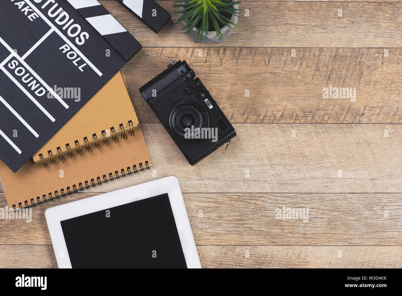 Film director desk with movie clapper board. Top view Stock Photo - Alamy