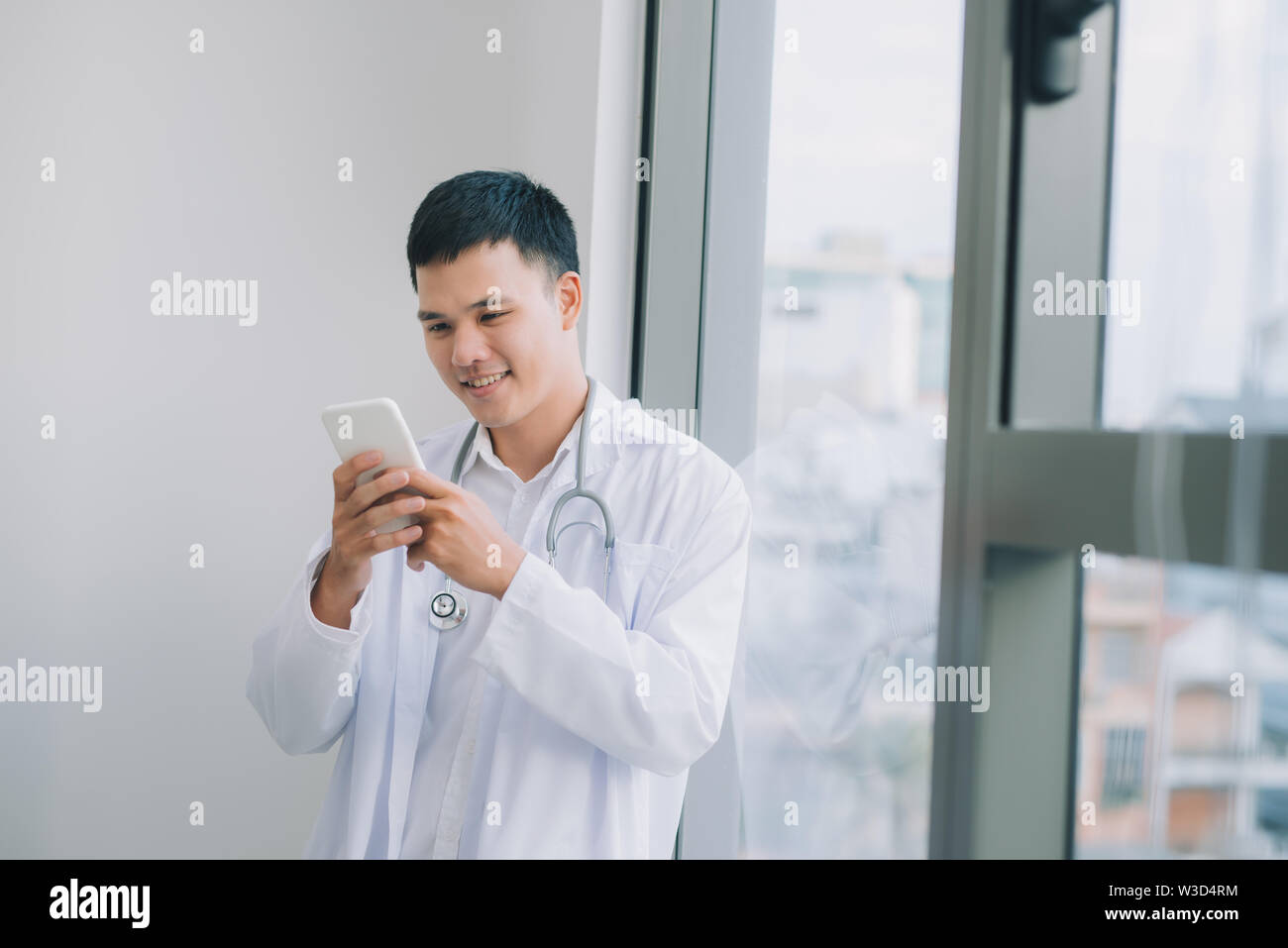 Smart handsome doctor using hi-res stock photography and images - Alamy