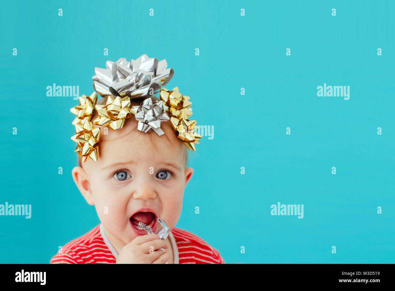 Baby with bow hi-res stock photography and images - Alamy