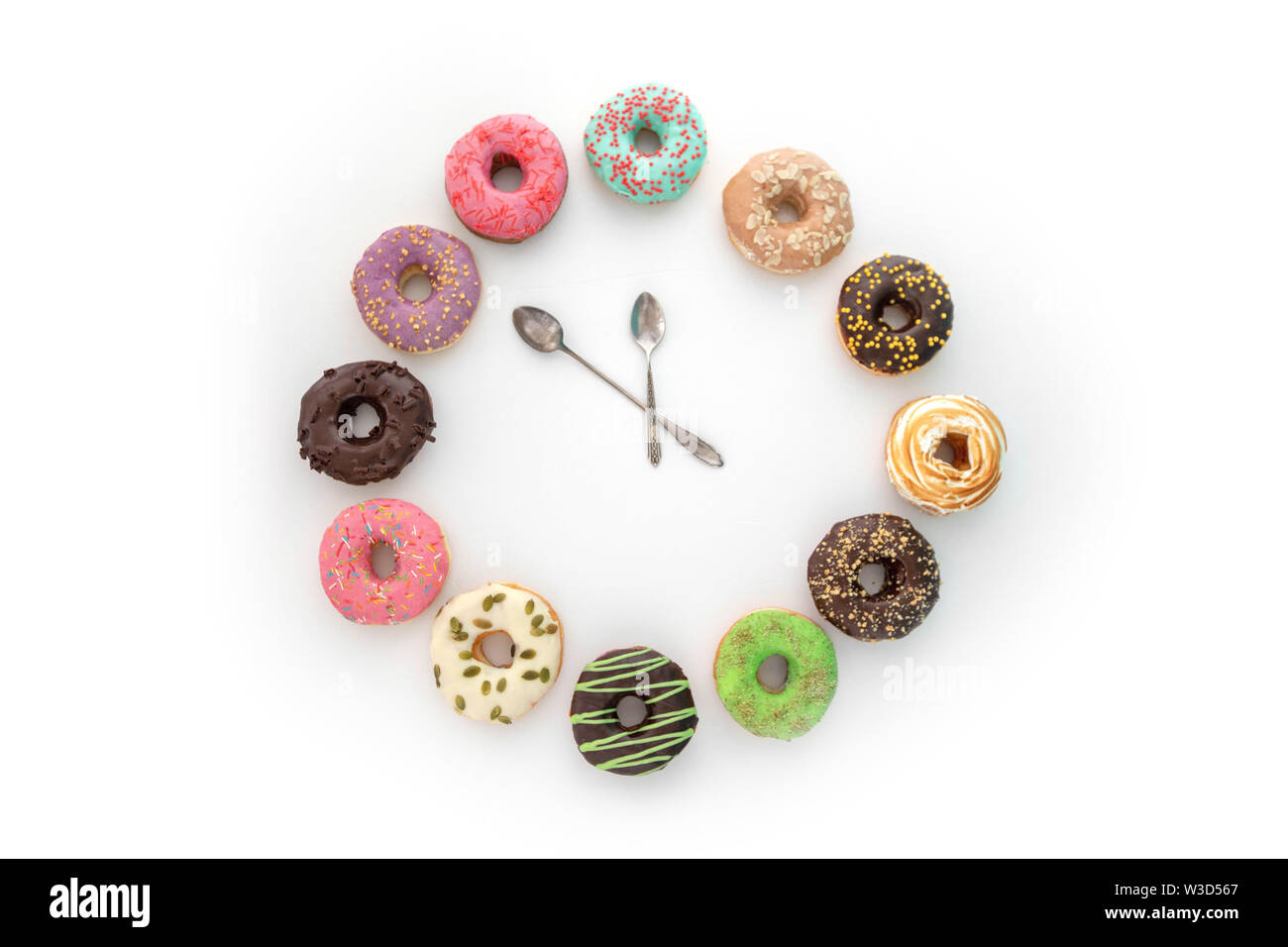 Sweet donuts arranged as clock Stock Photo - Alamy
