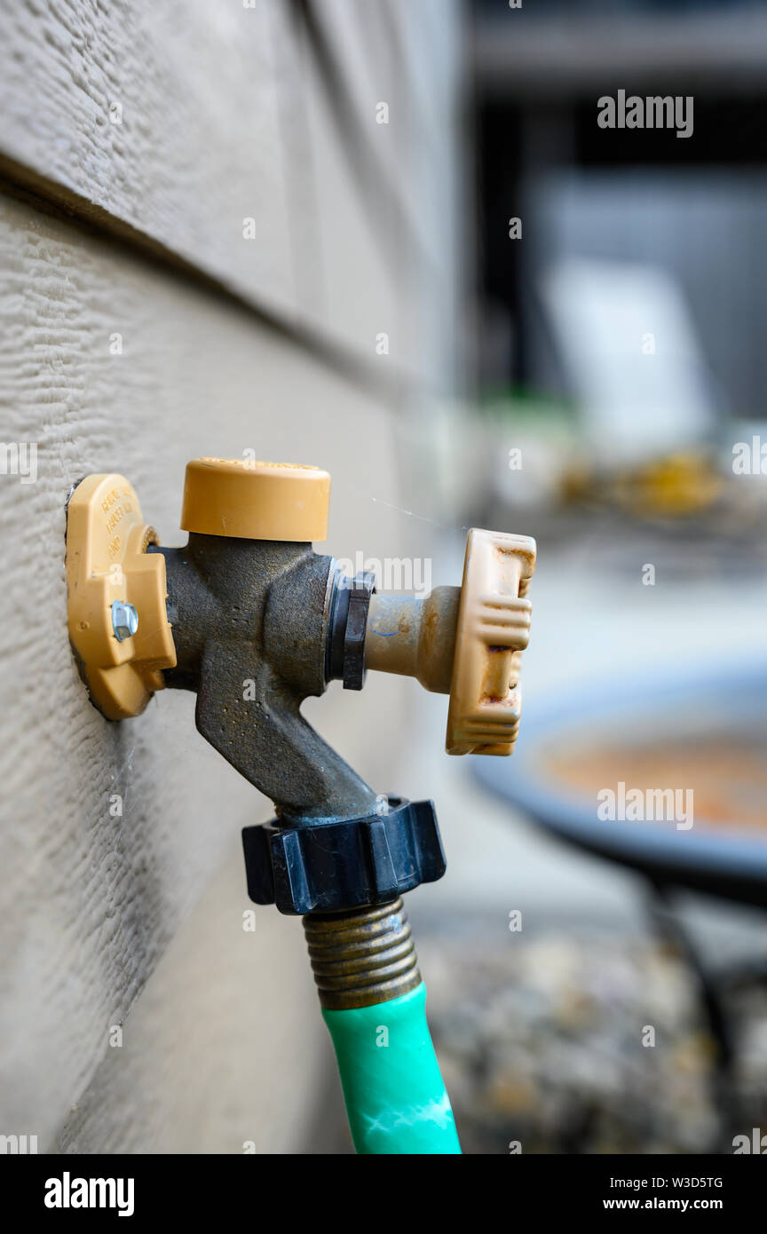 Handle-Operated Freezeless Residential Wall Hydrant mounted on exterior ...