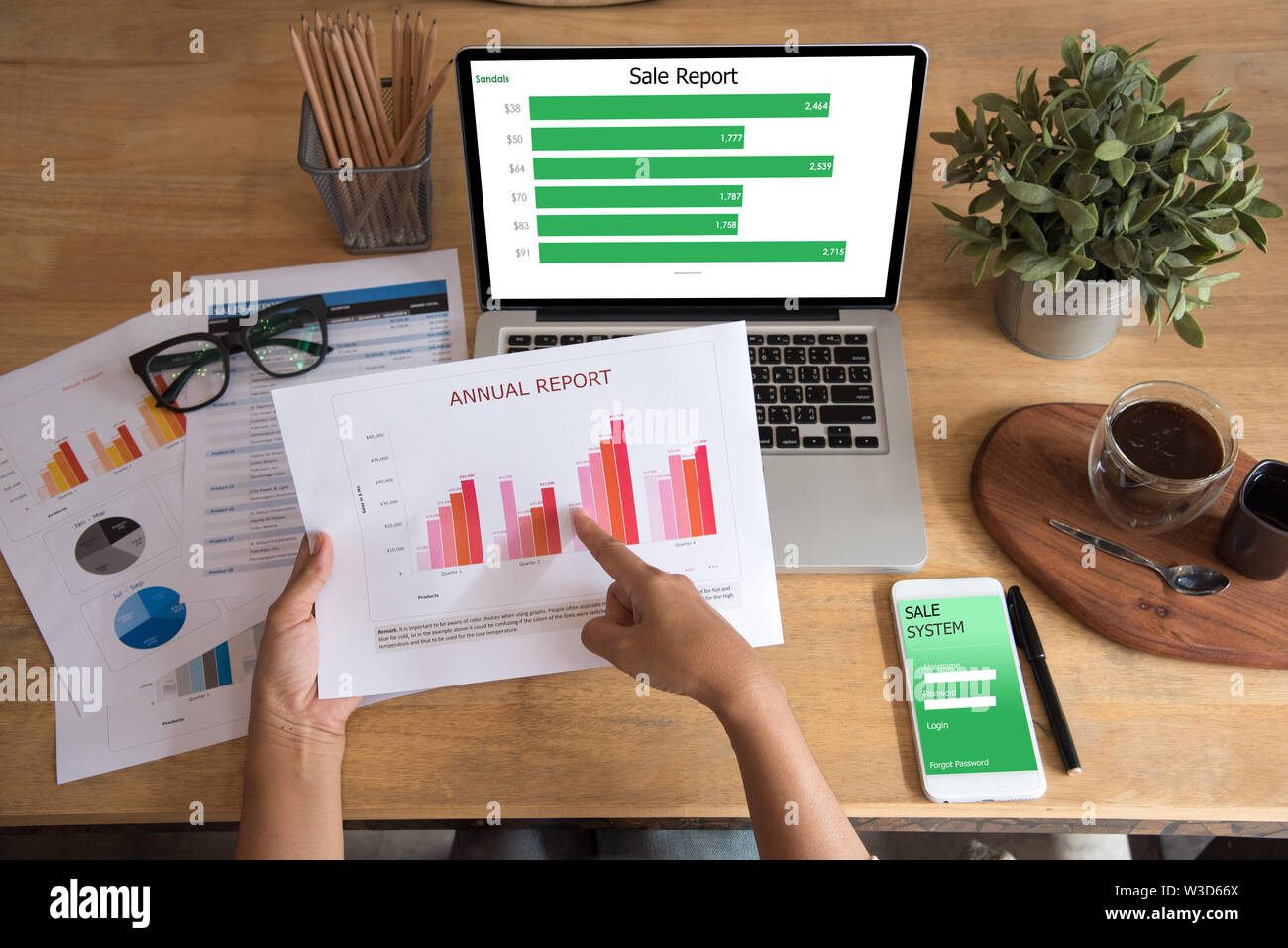Sale Manager Preparing Sale Report by using Laptop and Logon to Sale ...