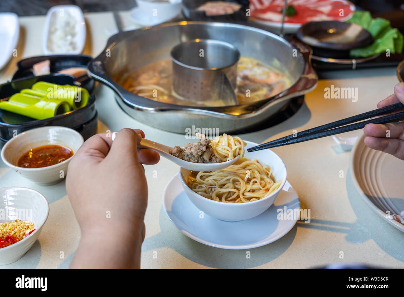 Pot noodle woman eating pot hi-res stock photography and images - Alamy