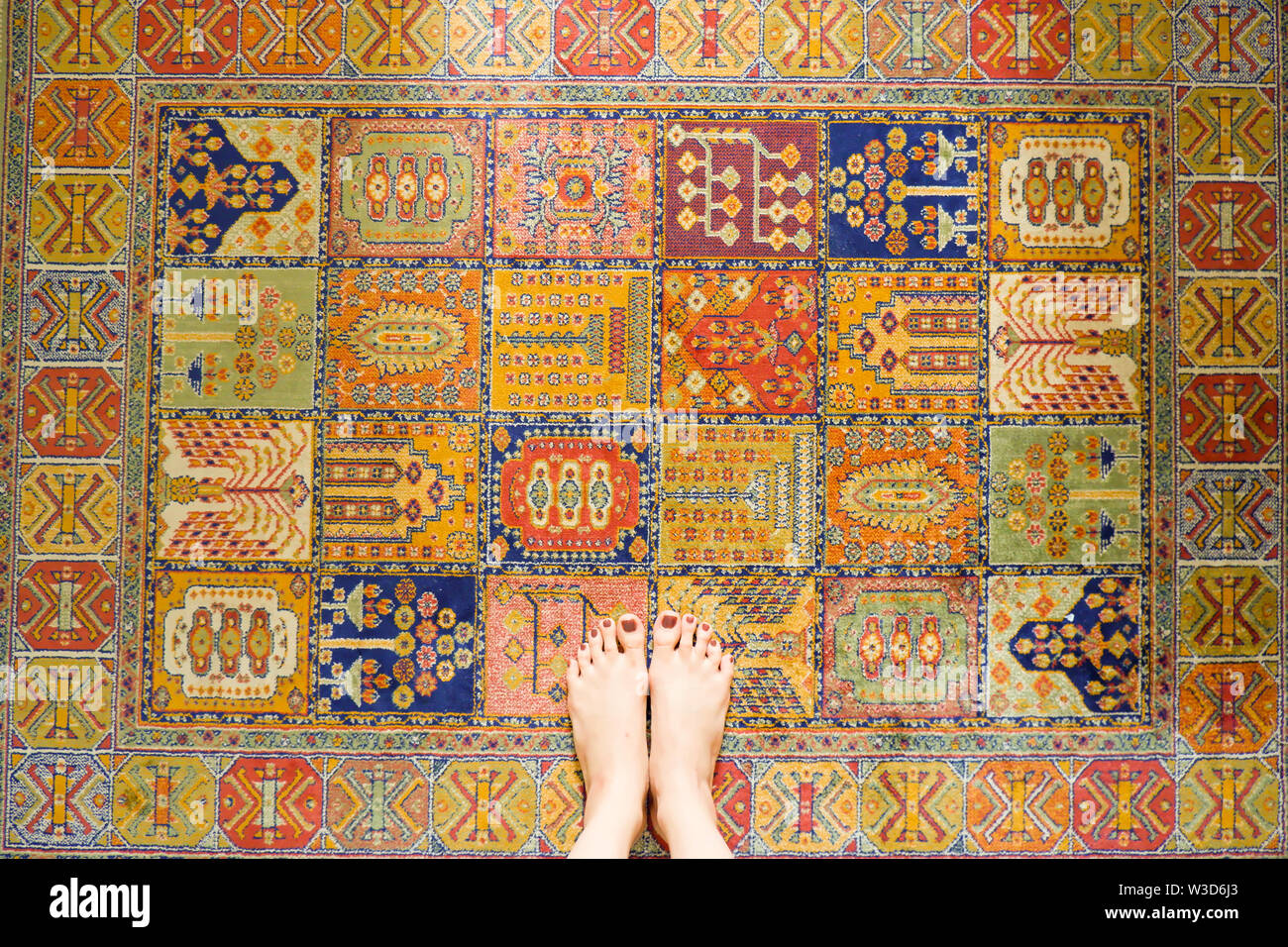 Woman Feet Standing on Vintage Carpet Stock Photo - Alamy