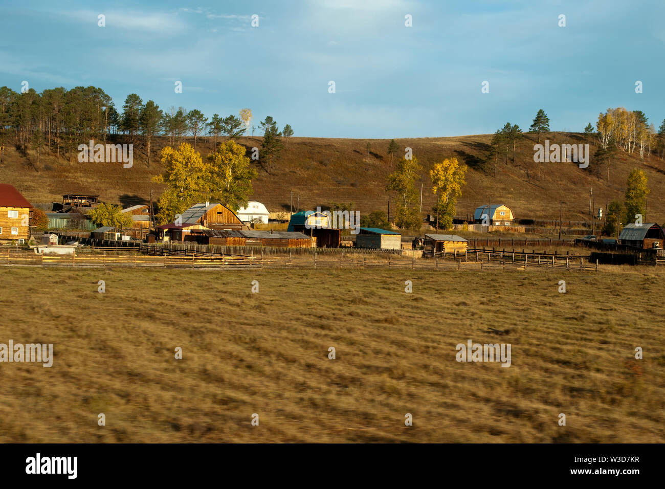 Rural Siberia Russia, view of a farming community on the road to Lake ...