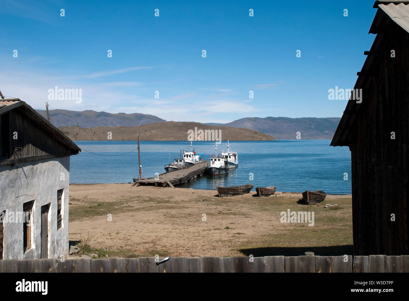 Rural Siberia Russia, wharf on Lake Baikal with fishing boats Stock ...