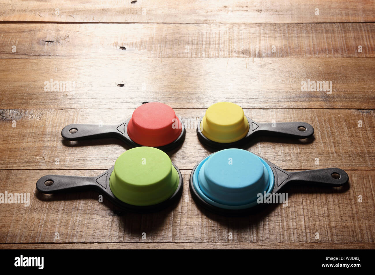 Measuring Cups on Wooden Background Stock Photo - Alamy