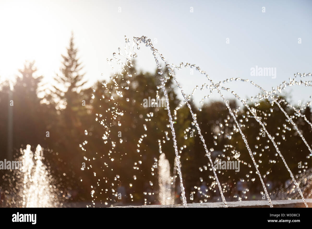 City fountain with splashes and jets of water hardened on a clear ...