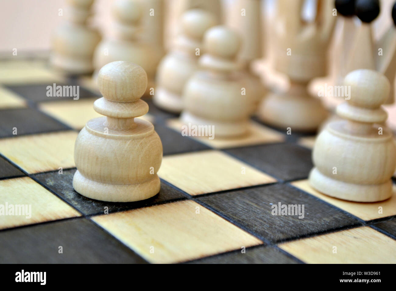 Wooden chess pieces on a chess Board Stock Photo - Alamy