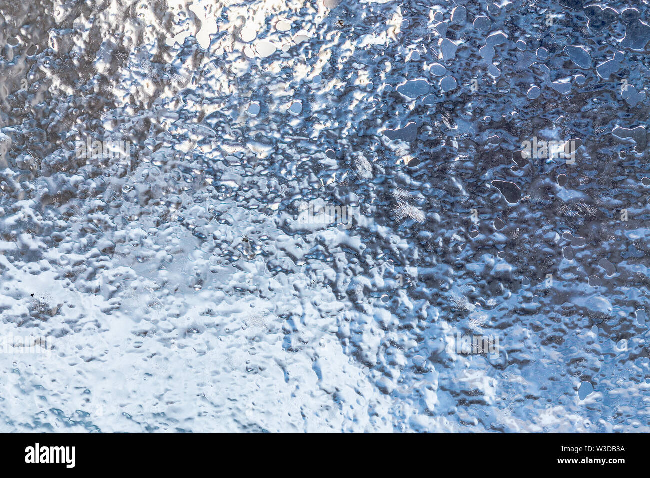 Frozen ice pattern on glass Stock Photo - Alamy