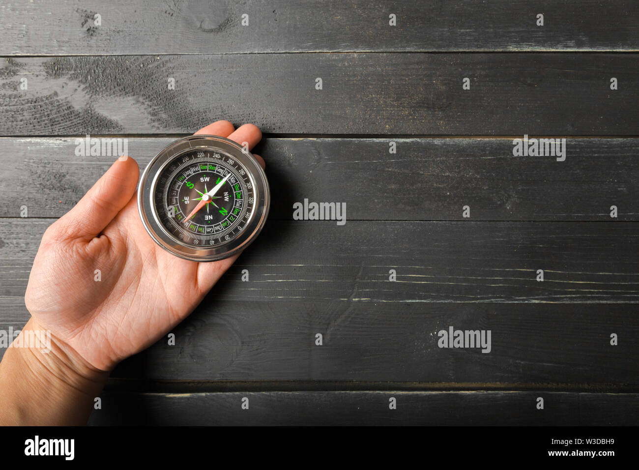 Man Hand Holding Chrome Compass Stock Photo - Alamy